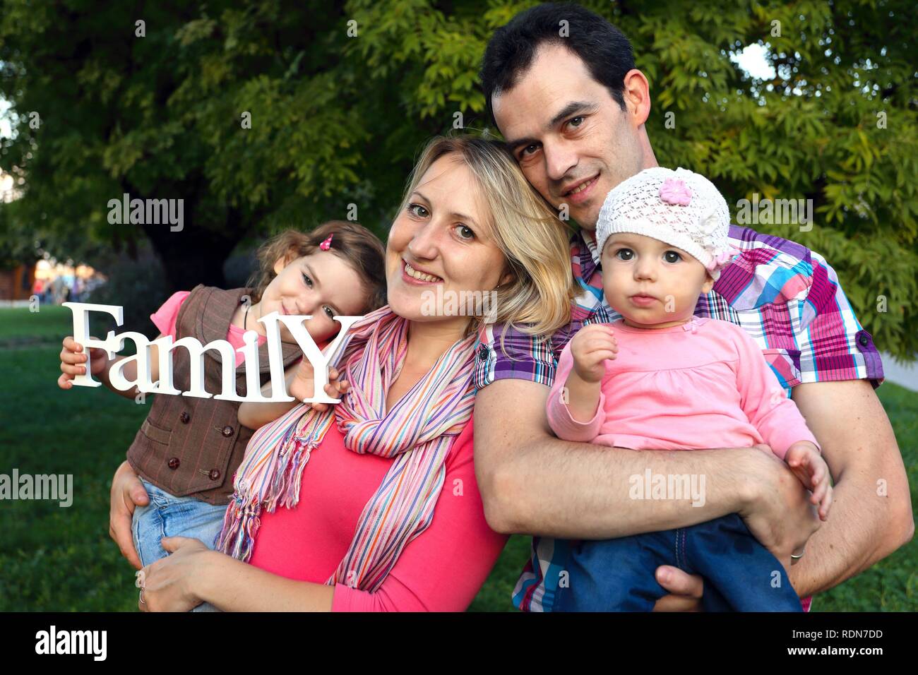 happy family with smiling faces outdoors Stock Photo - Alamy