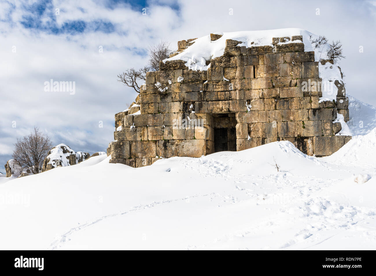 Tower of Caudius covered in snow during winter, Faqra Roman ruins ...