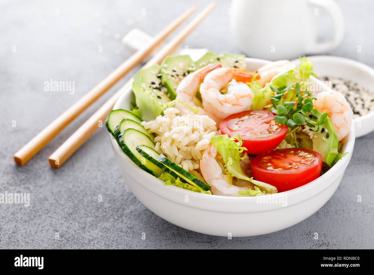 Hawaiian poke bowl with shrimps, rice and vegetables, healthy Buddha ...
