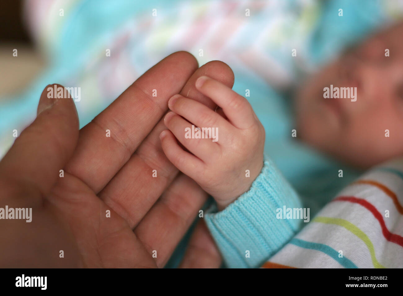 baby hands with father Stock Photo - Alamy