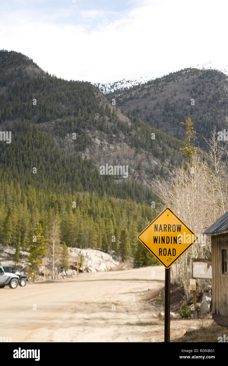 A Narrow Winding Road warning sign in a Colorado mountain town Stock ...