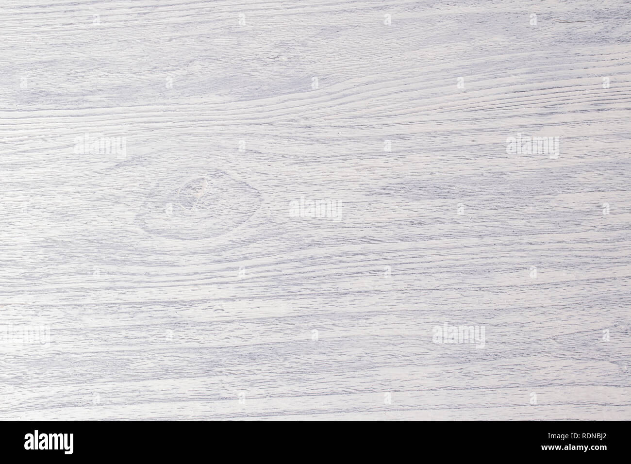 Texture of white rustic wooden table background in the rays of light ...