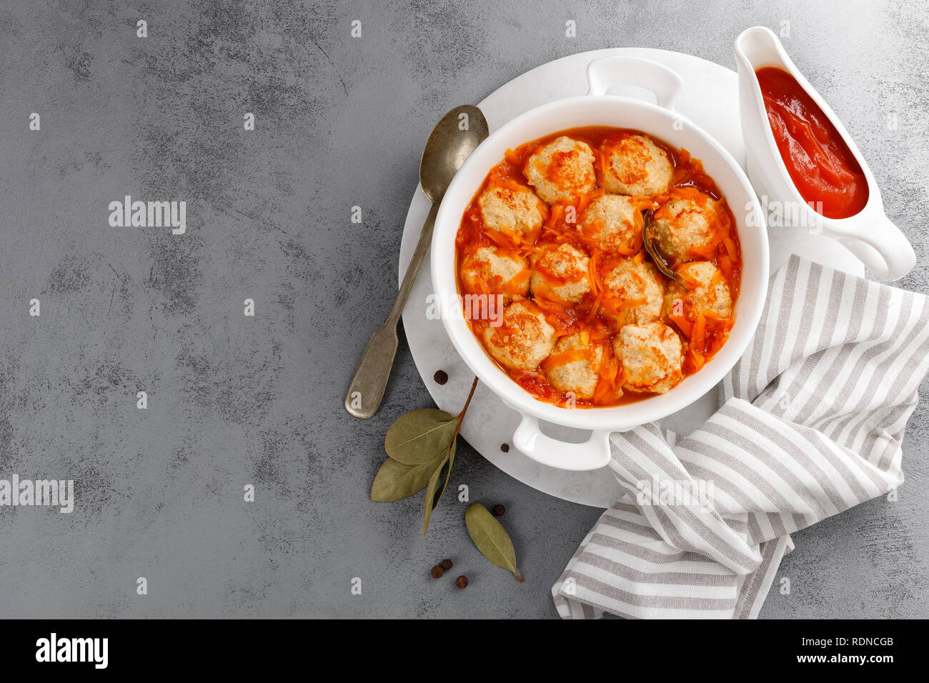 Fish meatballs in tomato sauce with carrot, top view Stock Photo - Alamy