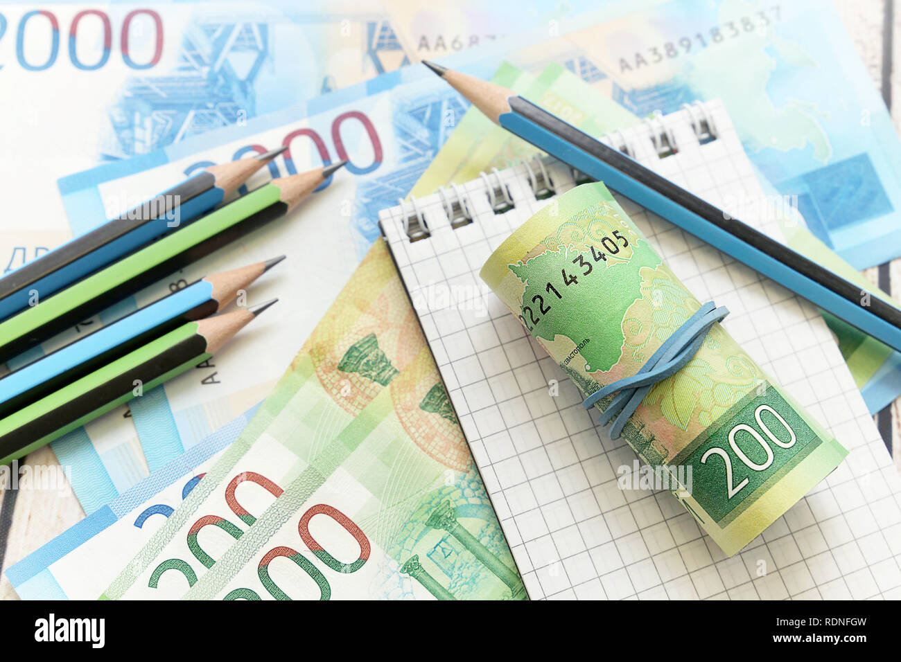 Russian money, notepad and pencil. Business still-life Stock Photo - Alamy