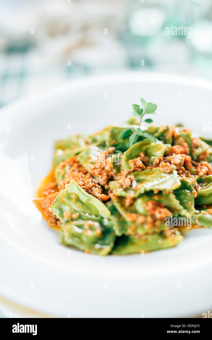 Green ravioli on plate Stock Photo - Alamy