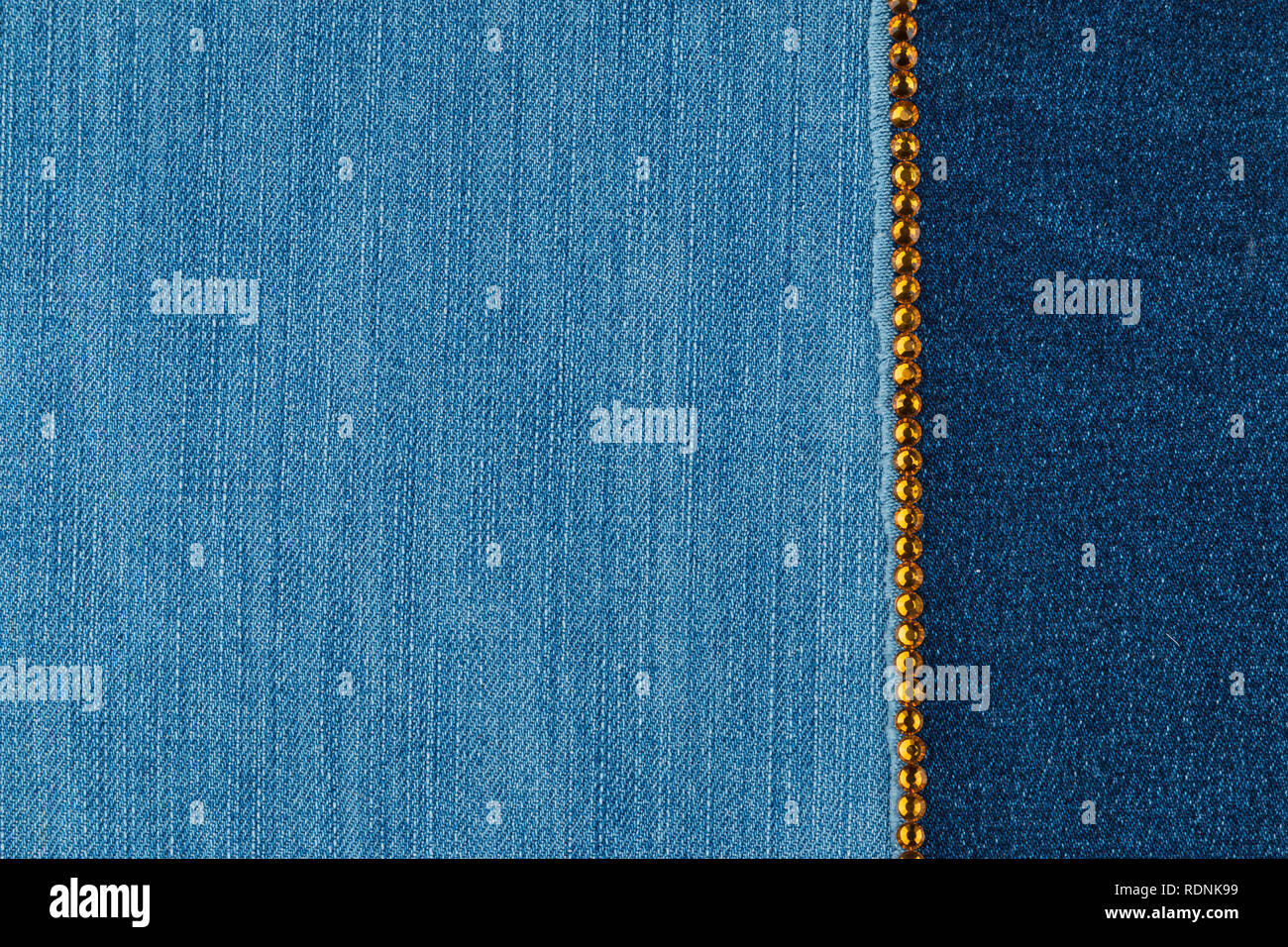 Trendy background with a line of yellow rhinestones. With empty space ...