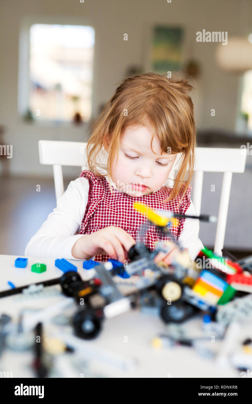 Girl playing with lego Stock Photo - Alamy