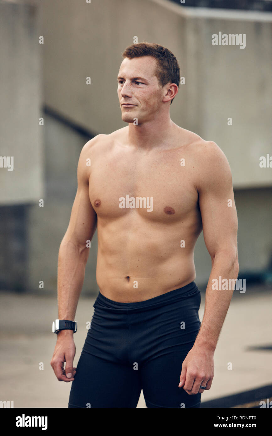Shirtless athlete looking away Stock Photo - Alamy