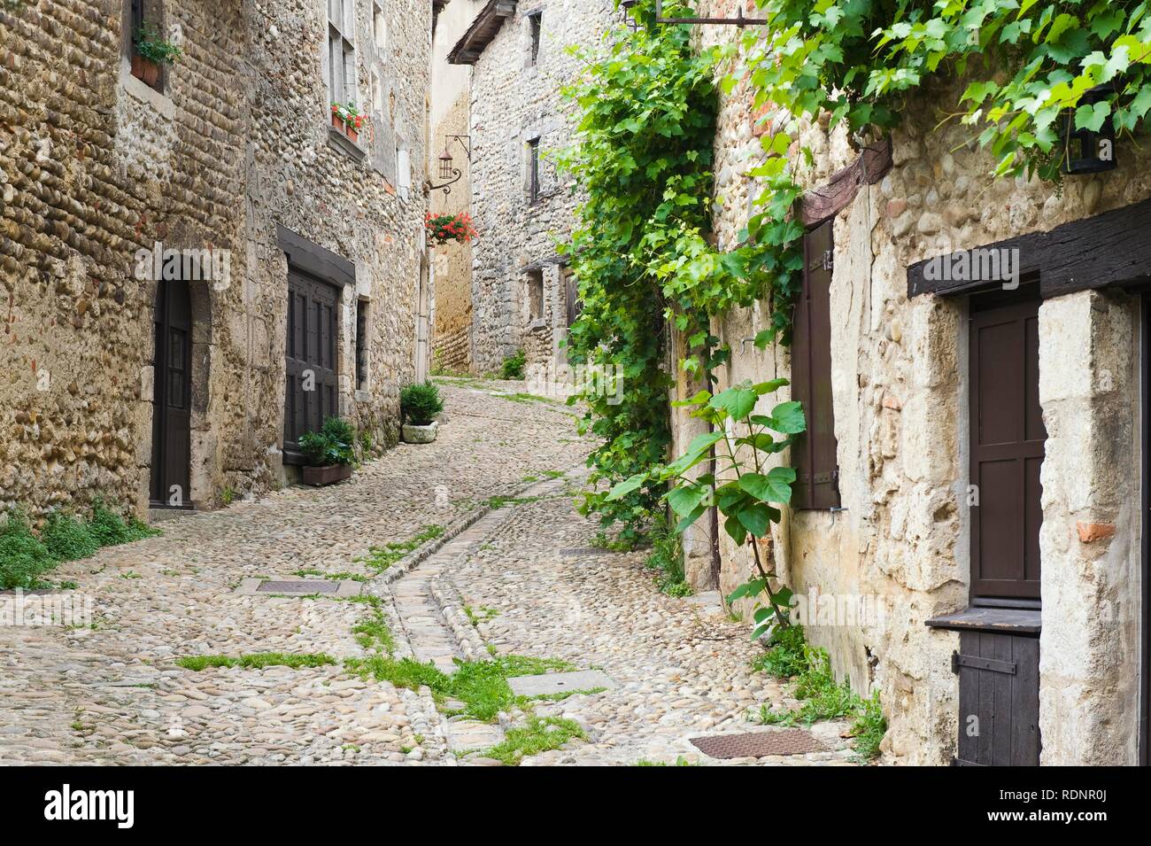 Cobblestone street, medieval walled town of Perouges, France, Europe ...