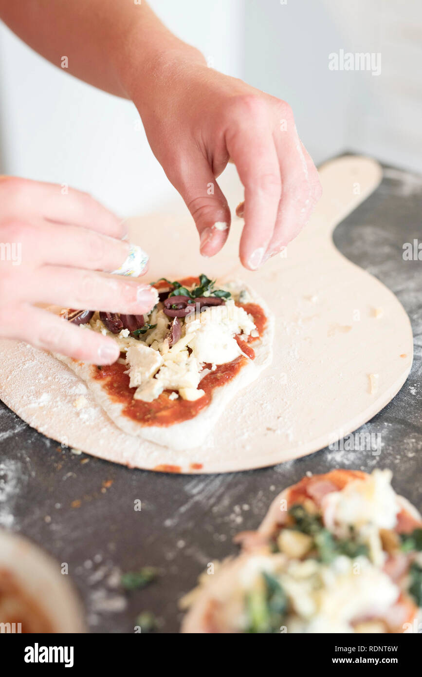 Child helping with making pizza Stock Photo - Alamy