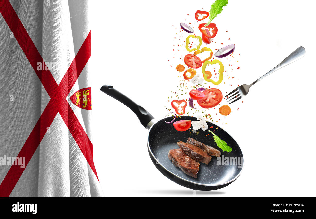 Frying pan with falling vegetables and meat, isolated objects. On the ...