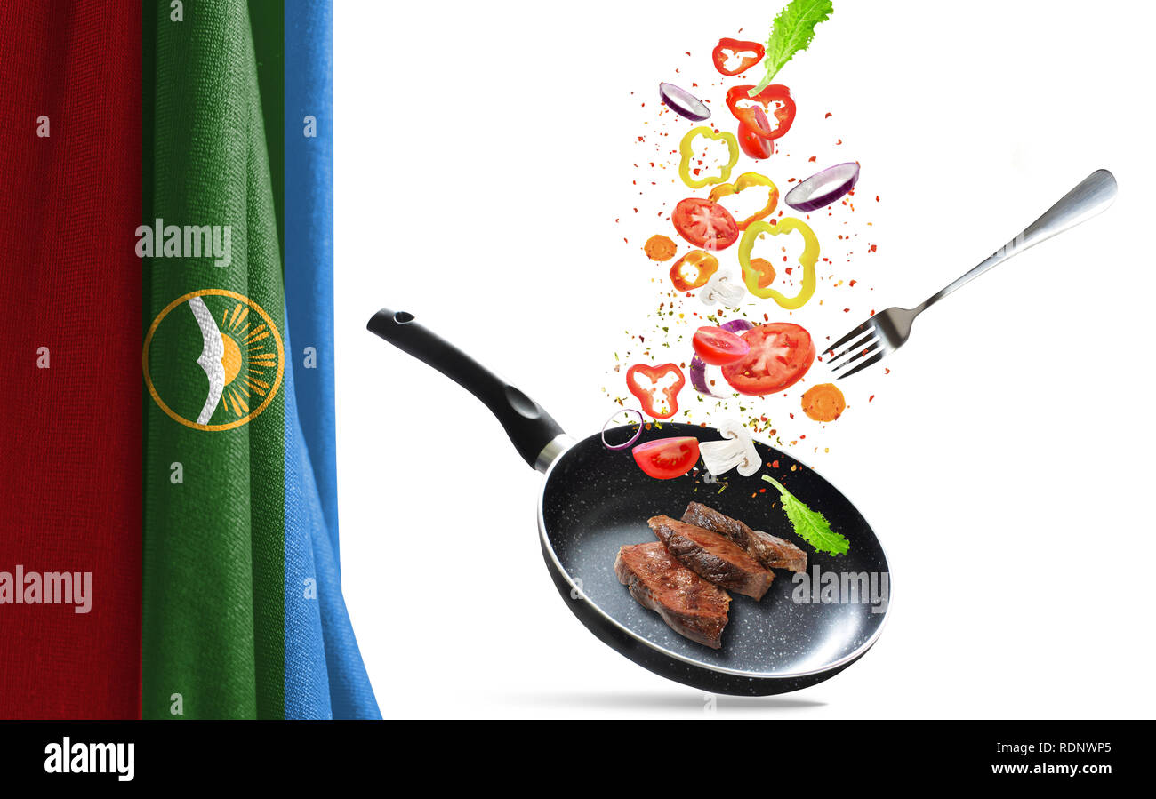 Frying pan with falling vegetables and meat, isolated objects. On the ...