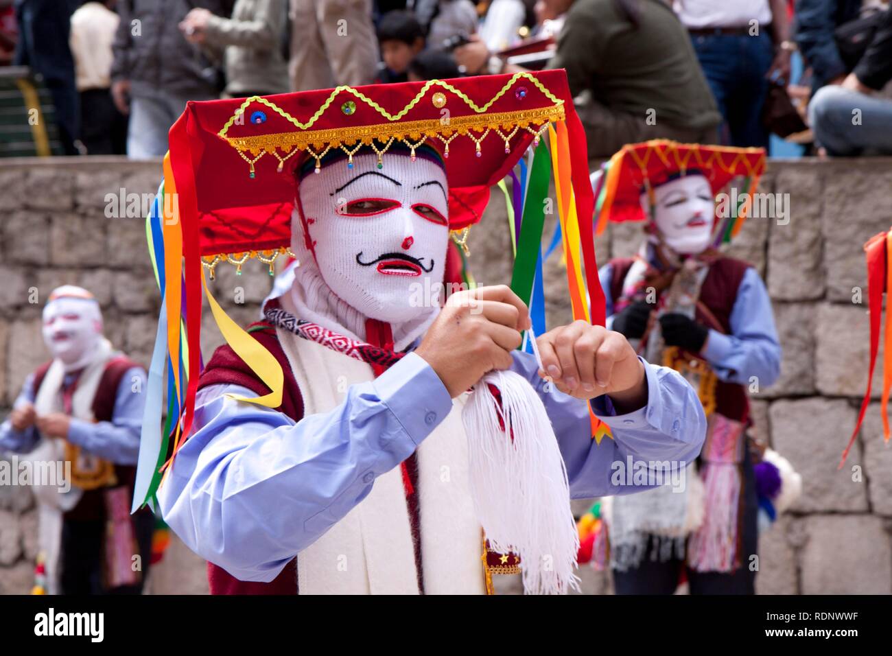 Man wearing a traditional costume at a parade in Aguas Calientes, Peru ...