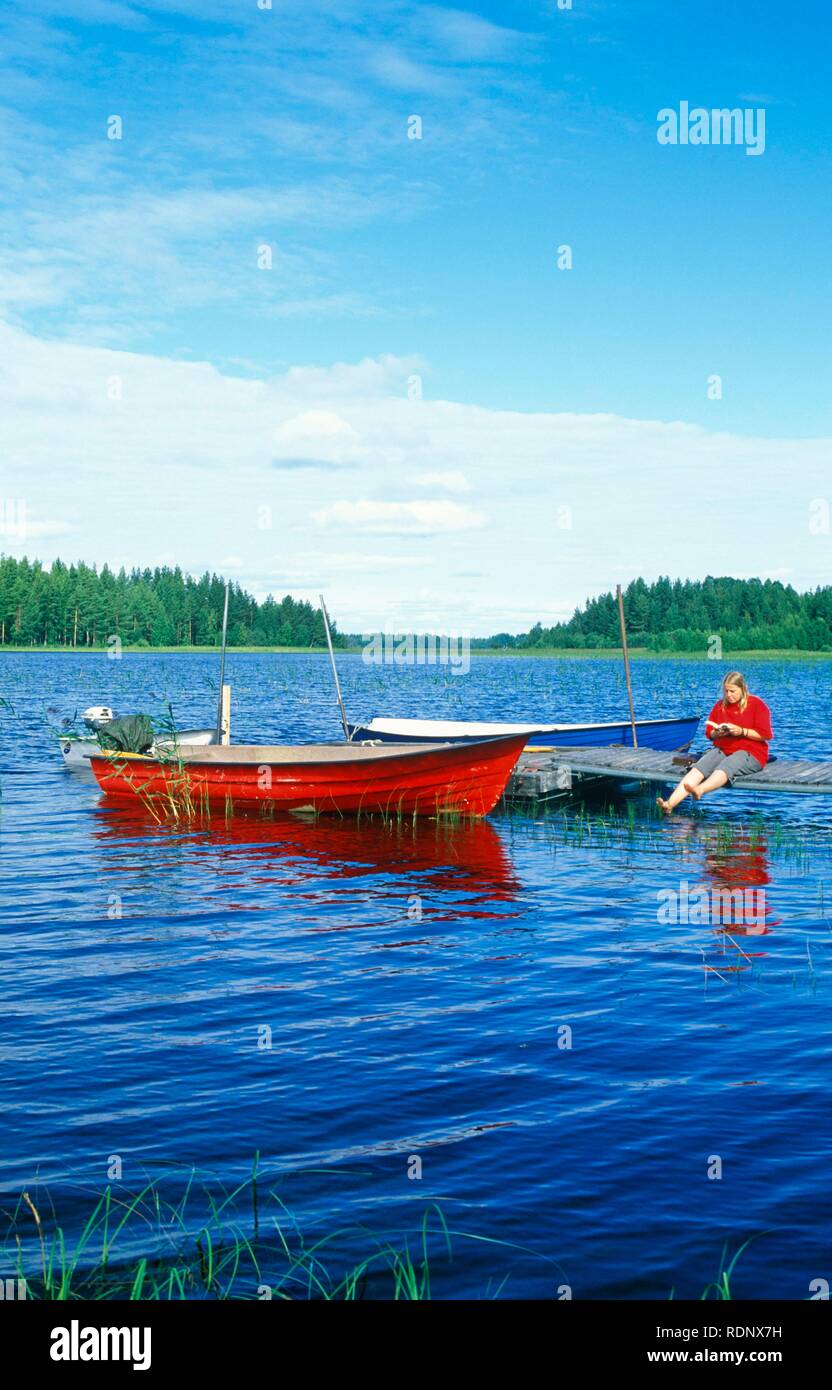Rowing boats at a wharf in Lake Siljan, Dalarna region, Southern Sweden ...
