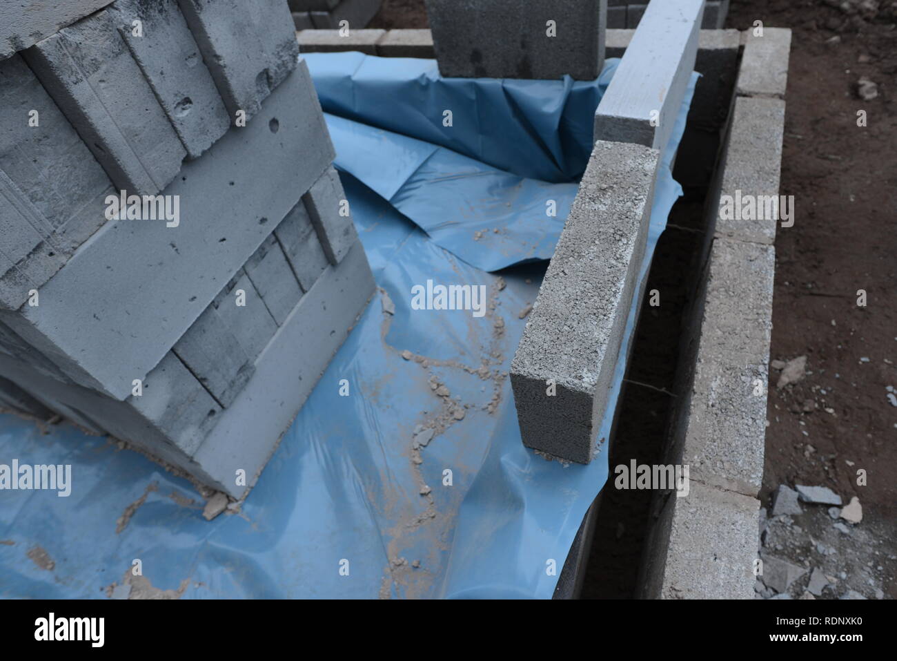 Constructing new cavity walls. Blocks and radon barrier sheet Stock ...