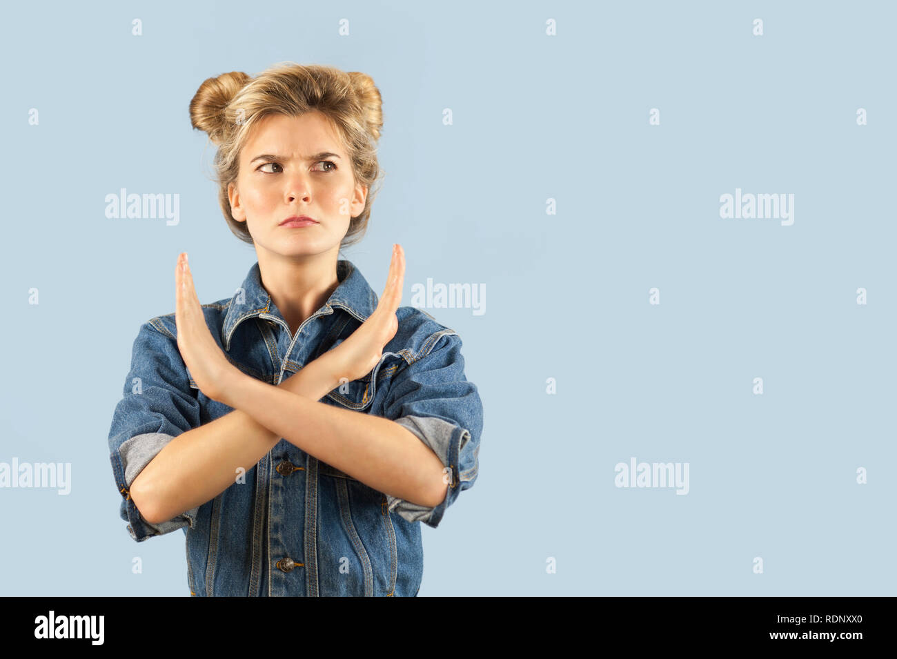 Very beautiful young emrtional girl shows with hands a stop sign on an ...