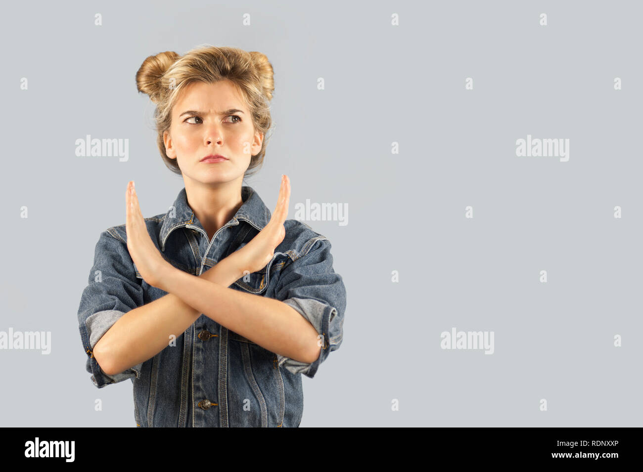 Very beautiful young emrtional girl shows with hands a stop sign on an ...