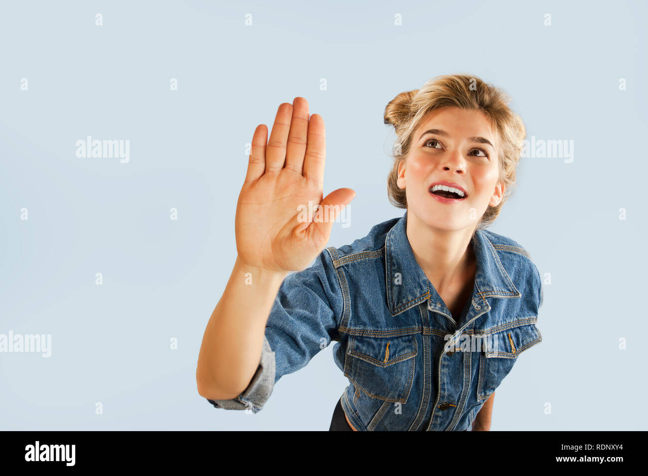 Very beautiful young emrtional girl shows with hands a stop sign on an ...