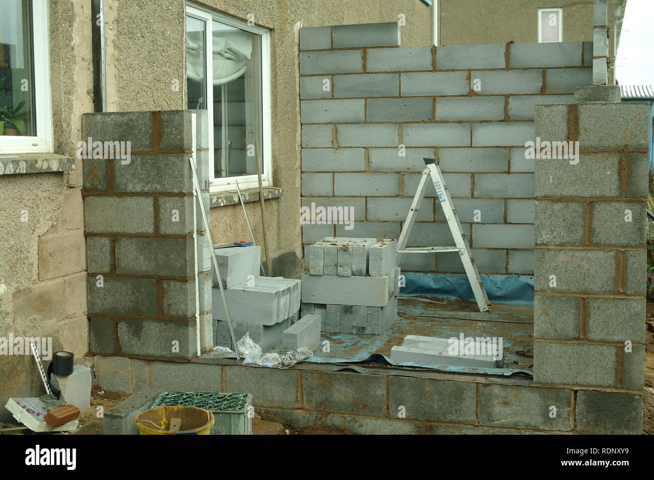 Building an extension. New block cavity wall being constructed Stock ...