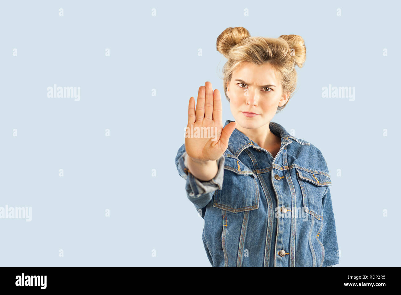 Very beautiful young emrtional girl shows with hands a stop sign on an ...