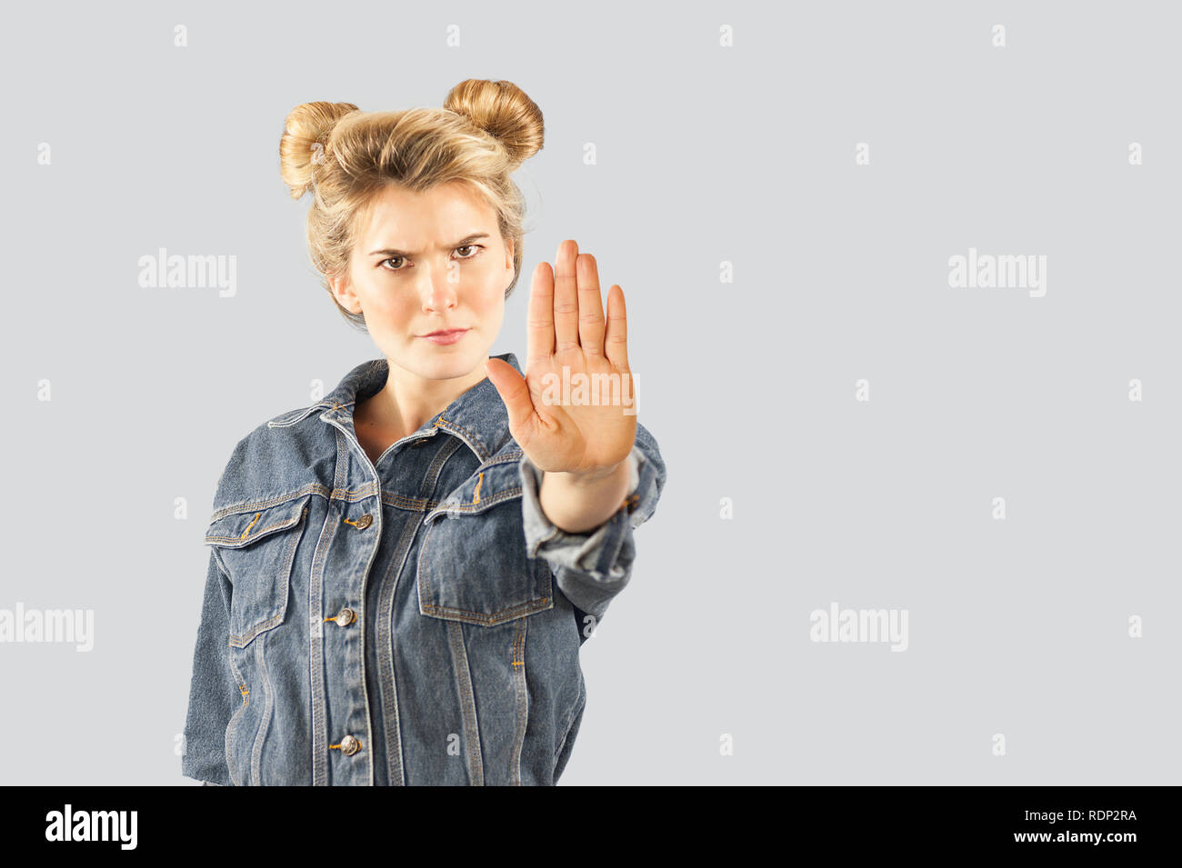 Very beautiful young emrtional girl shows with hands a stop sign on an ...