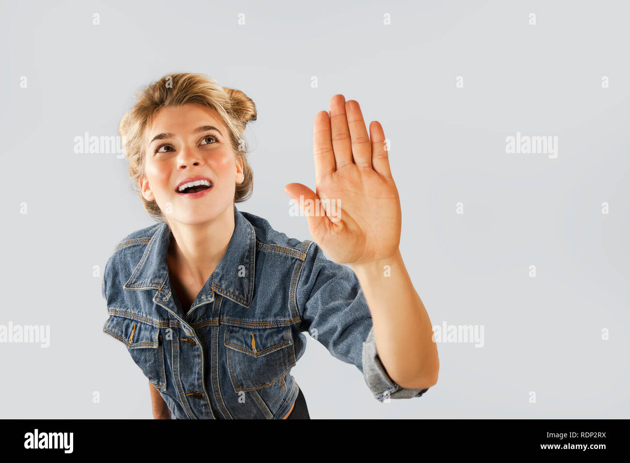 Very beautiful young emrtional girl shows with hands a stop sign on an ...