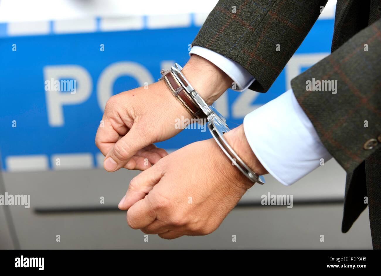 Photo man in handcuffs hi-res stock photography and images - Alamy