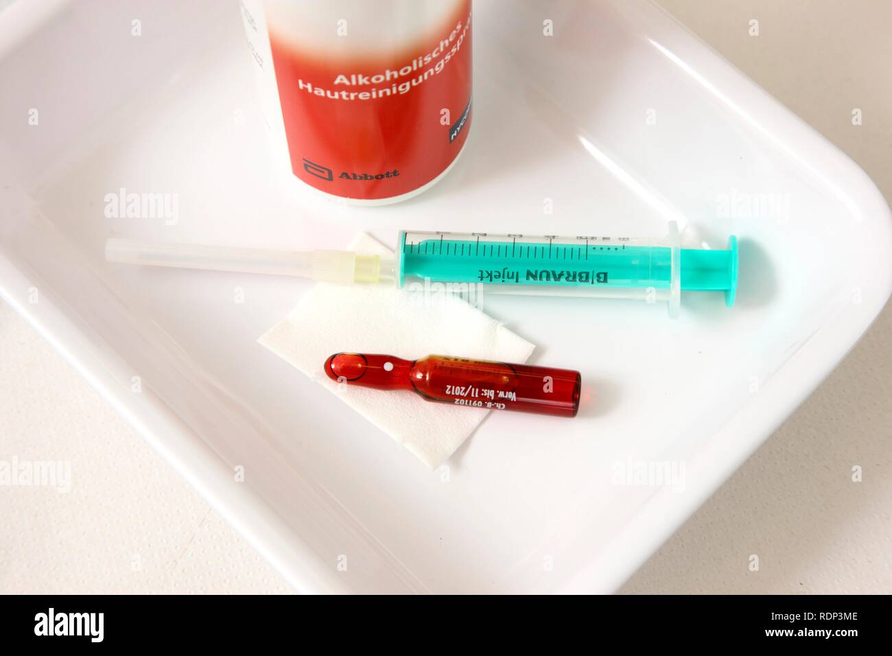 Doctor's surgery, injection with a disposable syringe, immunisation ...