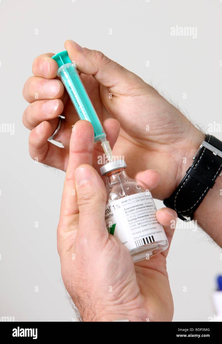 Doctor's surgery, injection with a disposable syringe, immunisation ...