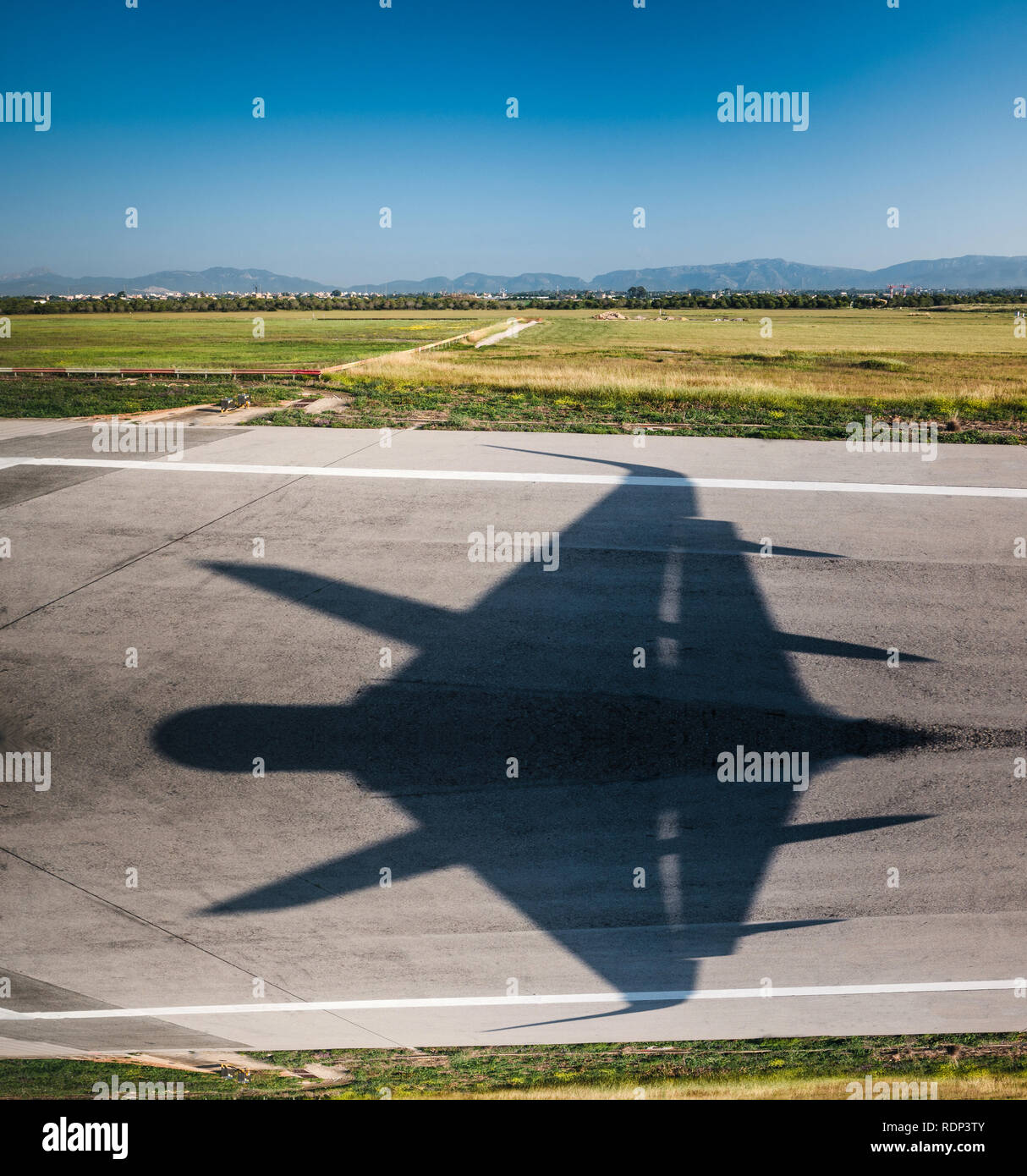 Abstract futuristic military plane shadow on the airport tarmac in ...