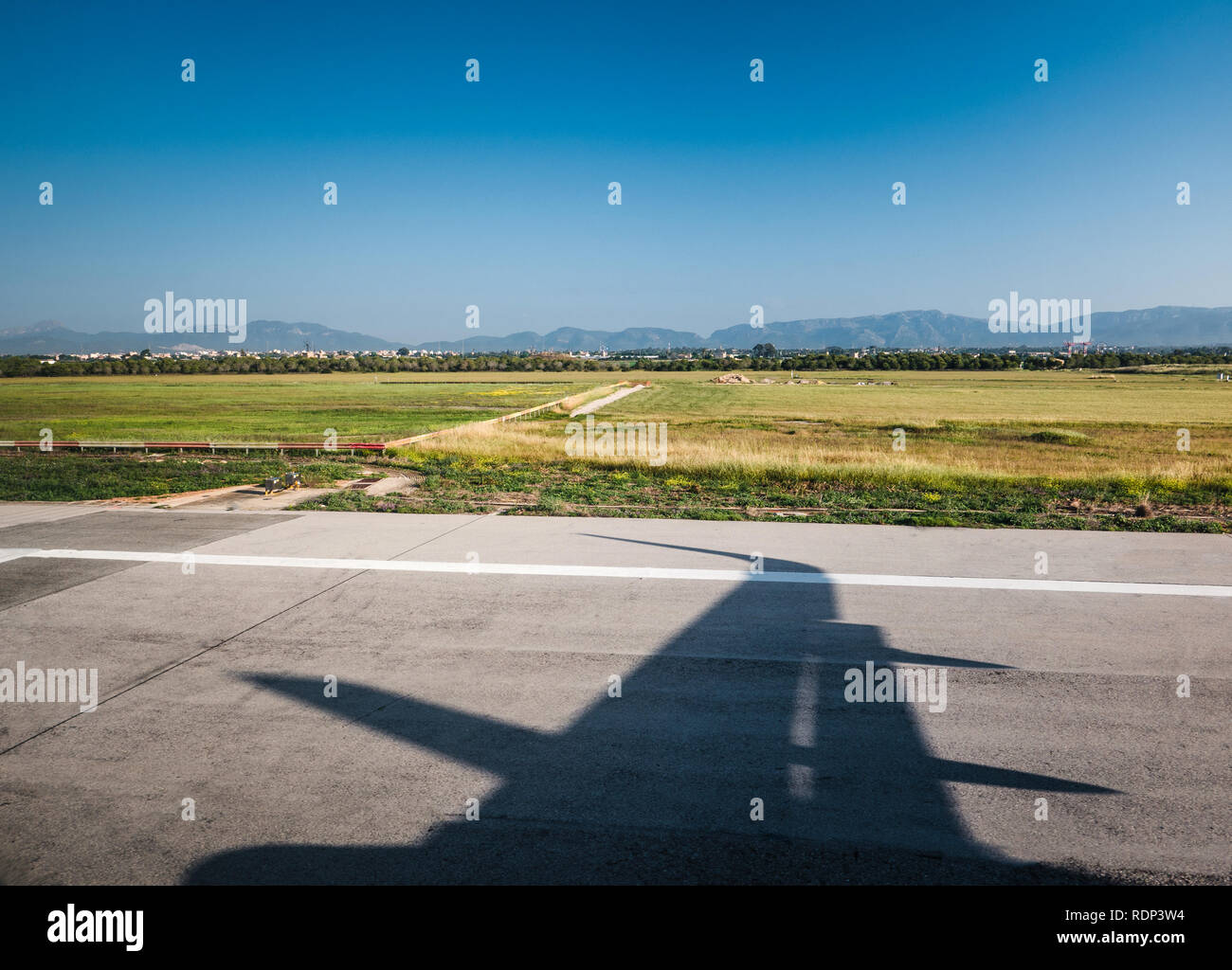 Airplane shadow on runway hi-res stock photography and images - Alamy