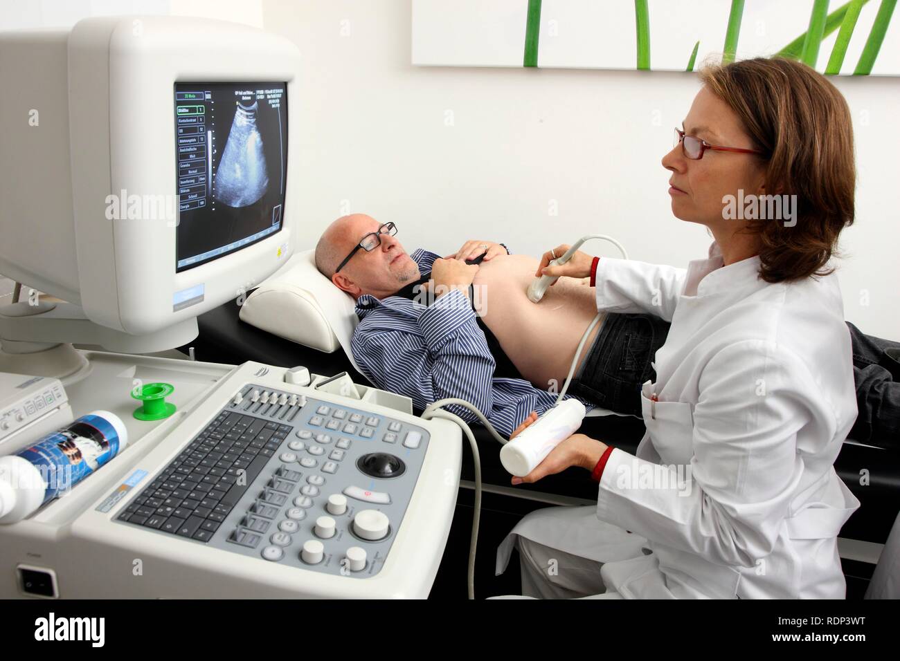 Medical practice, doctor with patient, ultrasonography, ultrasound ...