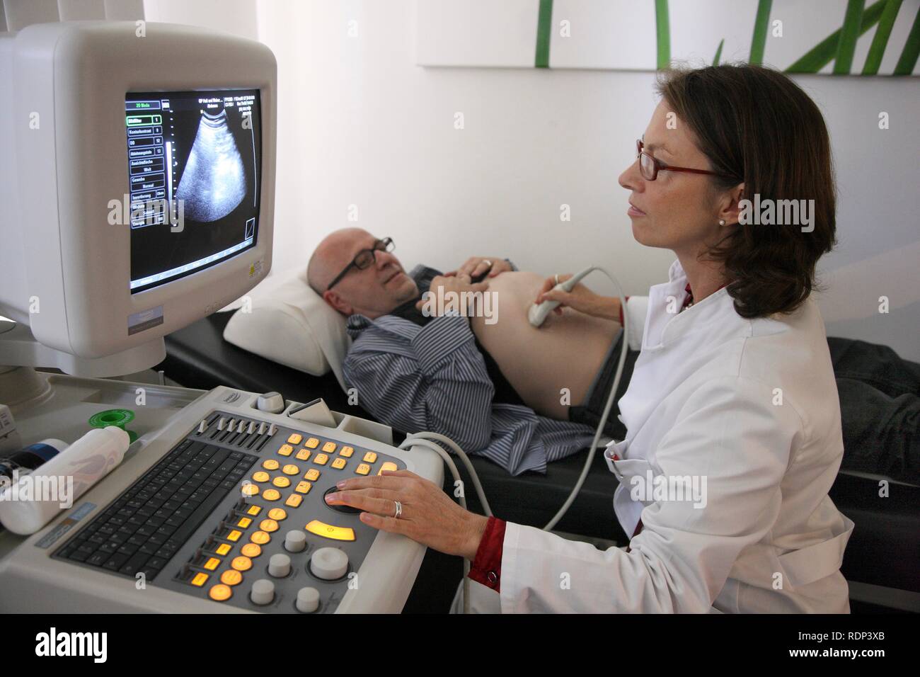 Medical practice, doctor with patient, ultrasonography, ultrasound ...