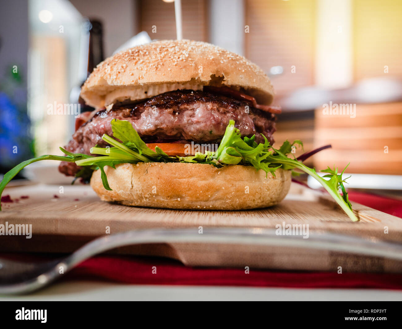 Side view of delicious burger in restaurant cafe side view with all the ...