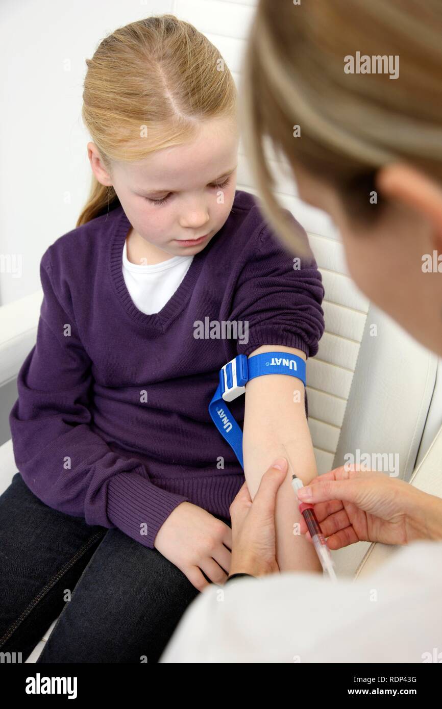 Medical practice, girl, 10 years, taking a blood sample for analysis in ...