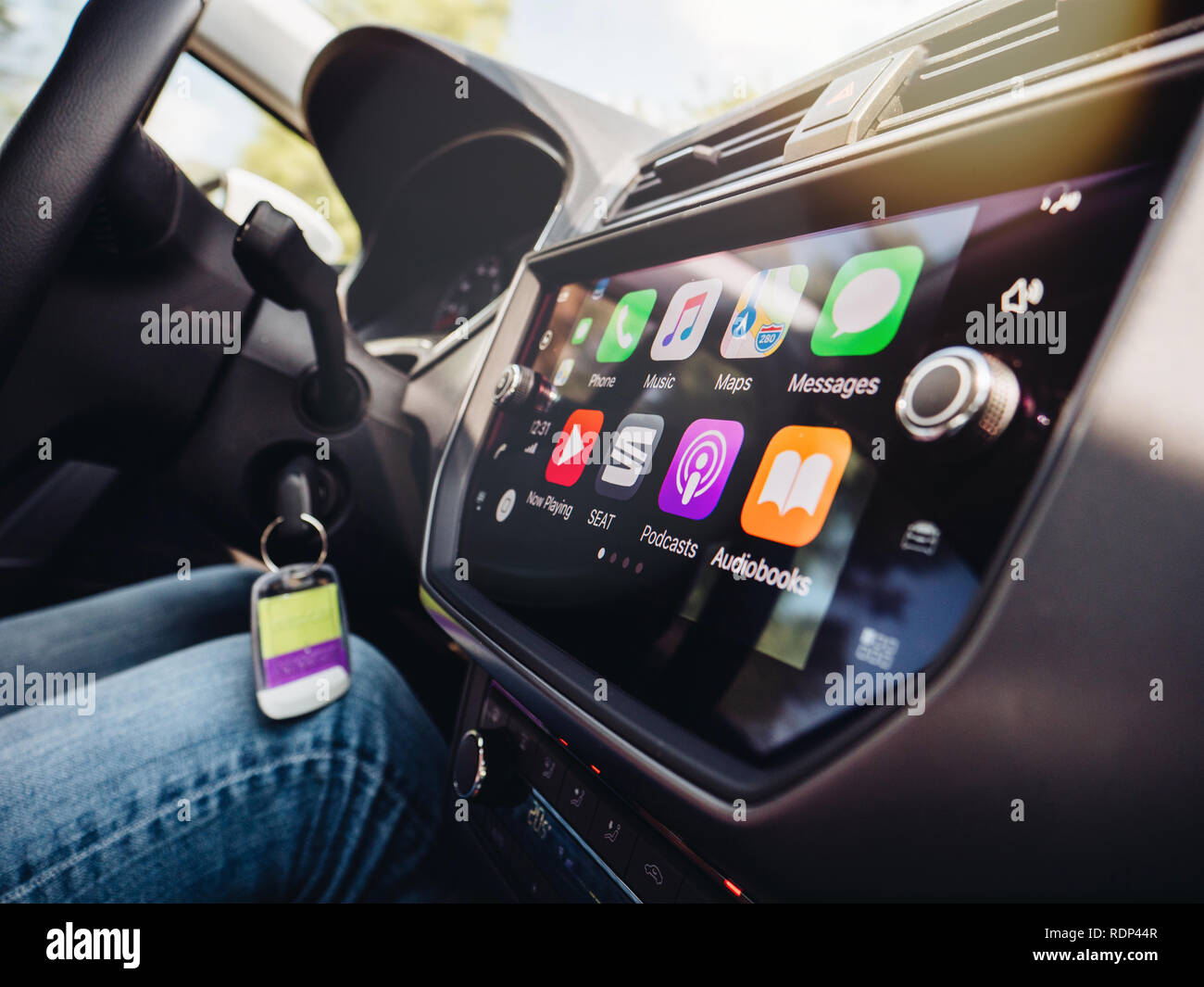 PALMA DE MALLORCA, SPAIN - MAY 10, 2018: Woman driving car with Apple ...