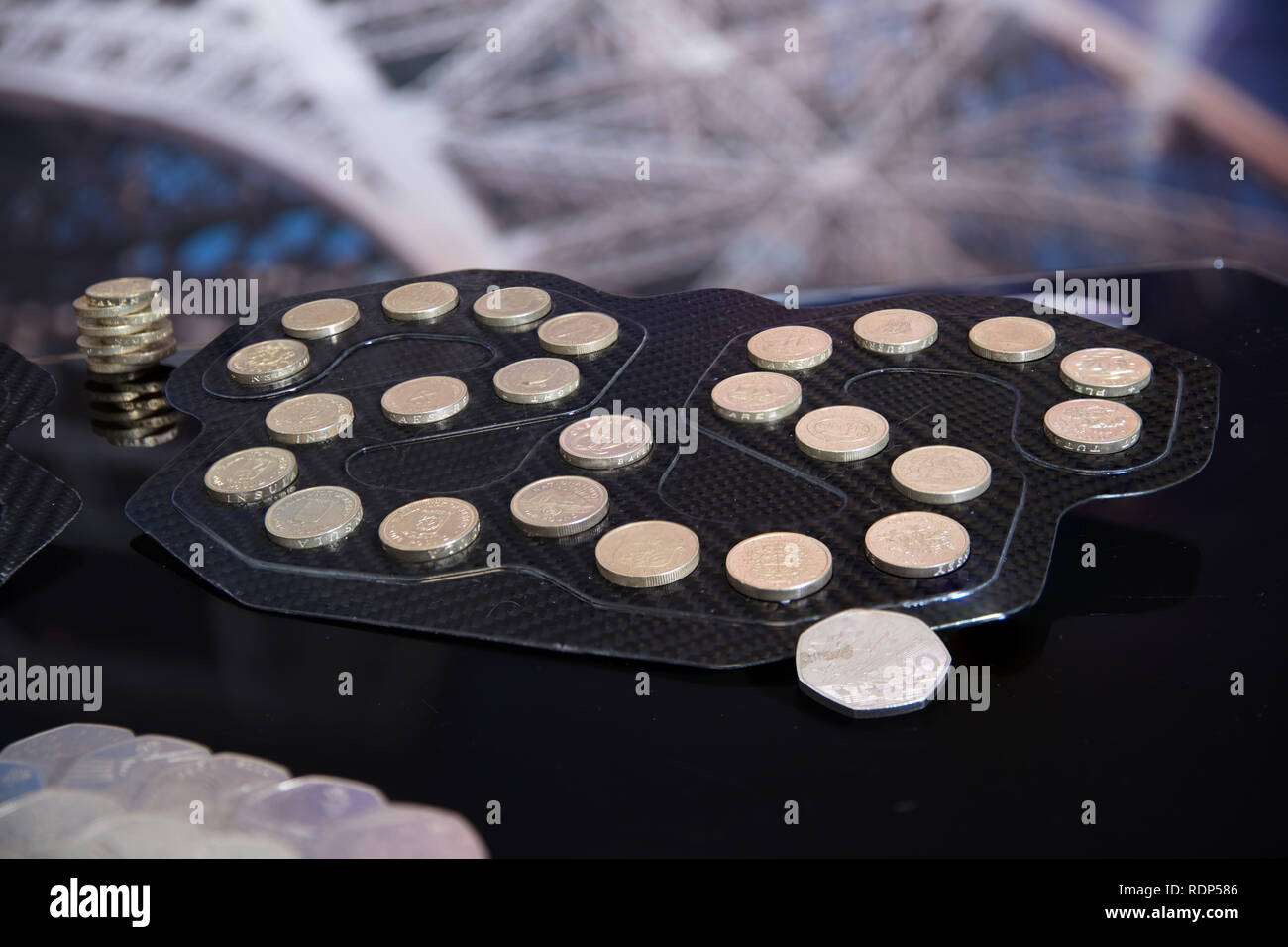 Old British one pound coins collection in the carbon fibre tray Stock ...