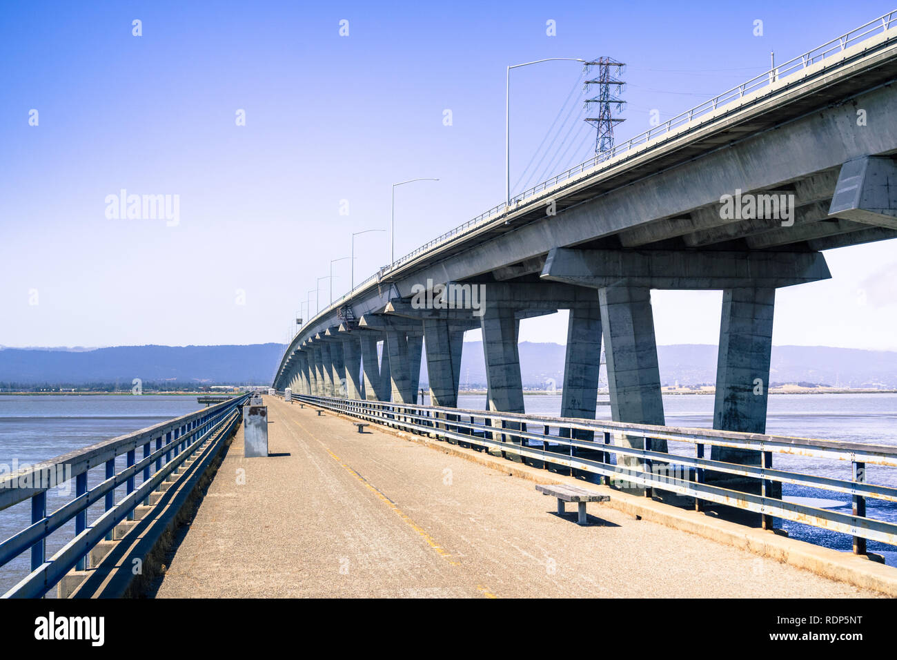Walking on the fishing pier situated next to Dumbarton Bridge ...