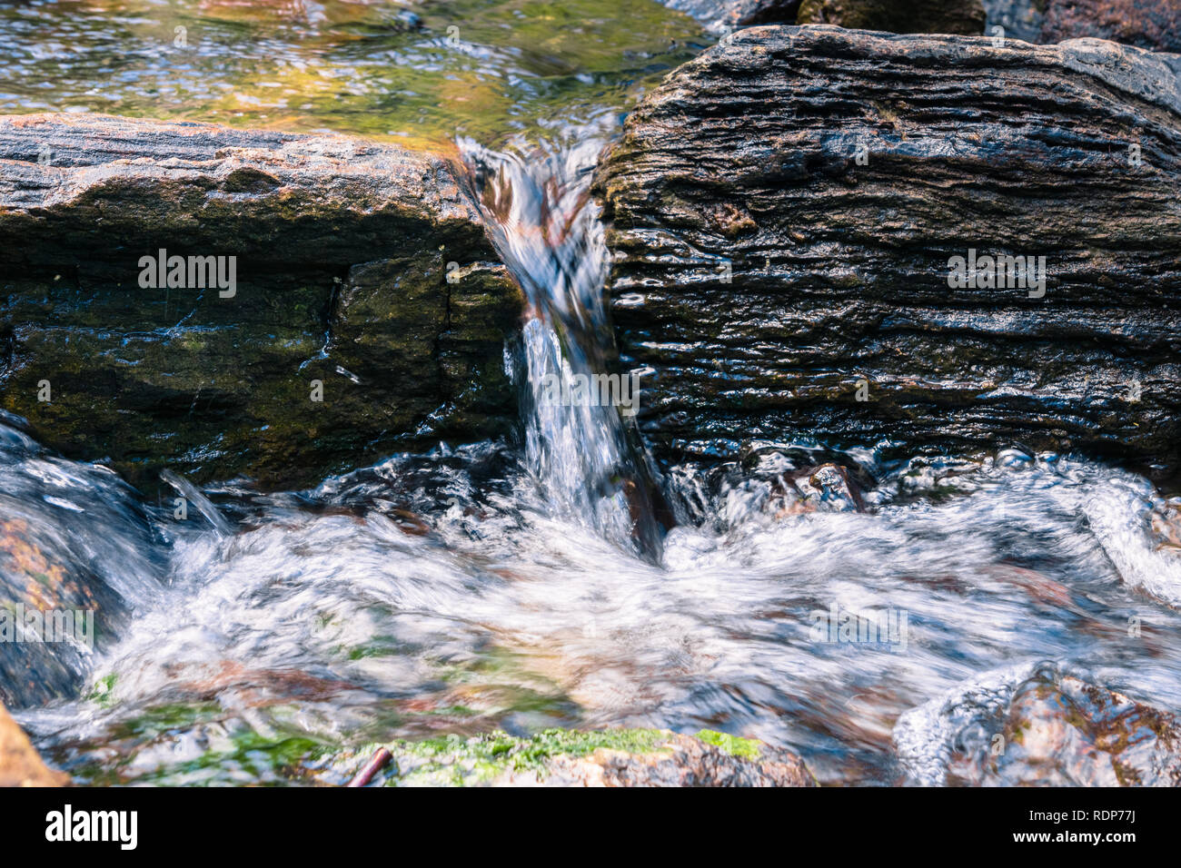 Water falling through rock hi-res stock photography and images - Alamy