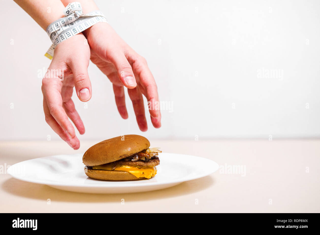 Hand reaching unhealthy food hi-res stock photography and images - Alamy