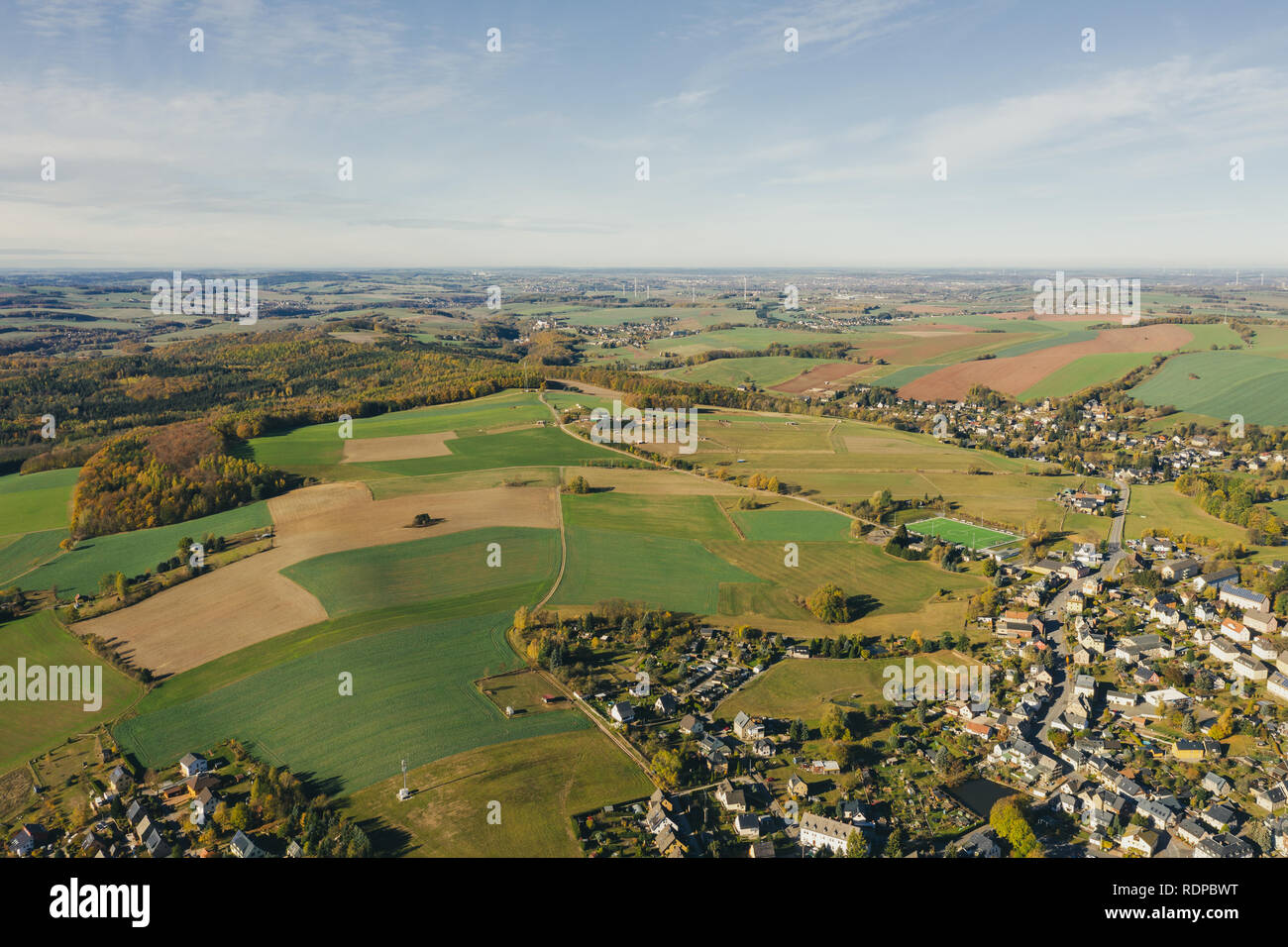 aerial view of landscape with meadows and a small german village or ...