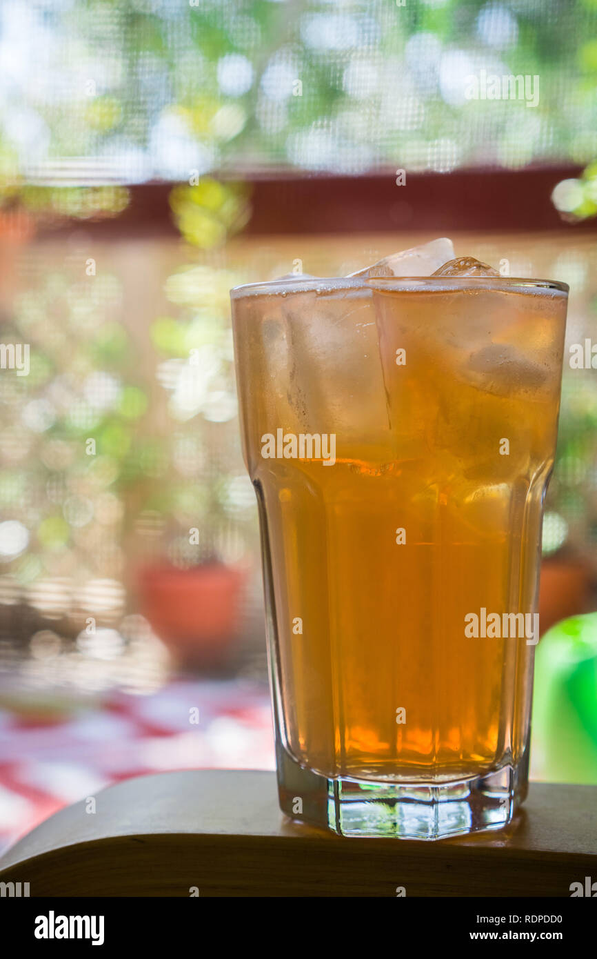 Ice cold drink on a hot summer day, sunny balcony in the background ...