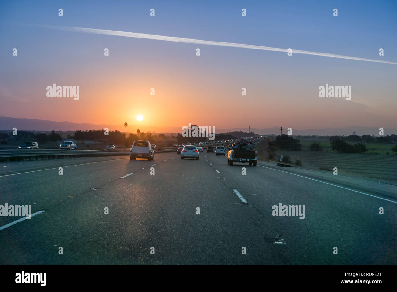Cars driving on the highway at sunset, San Francisco bay area ...