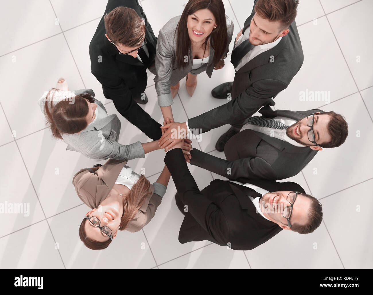 top view.smiling group of business people standing together.the concept ...