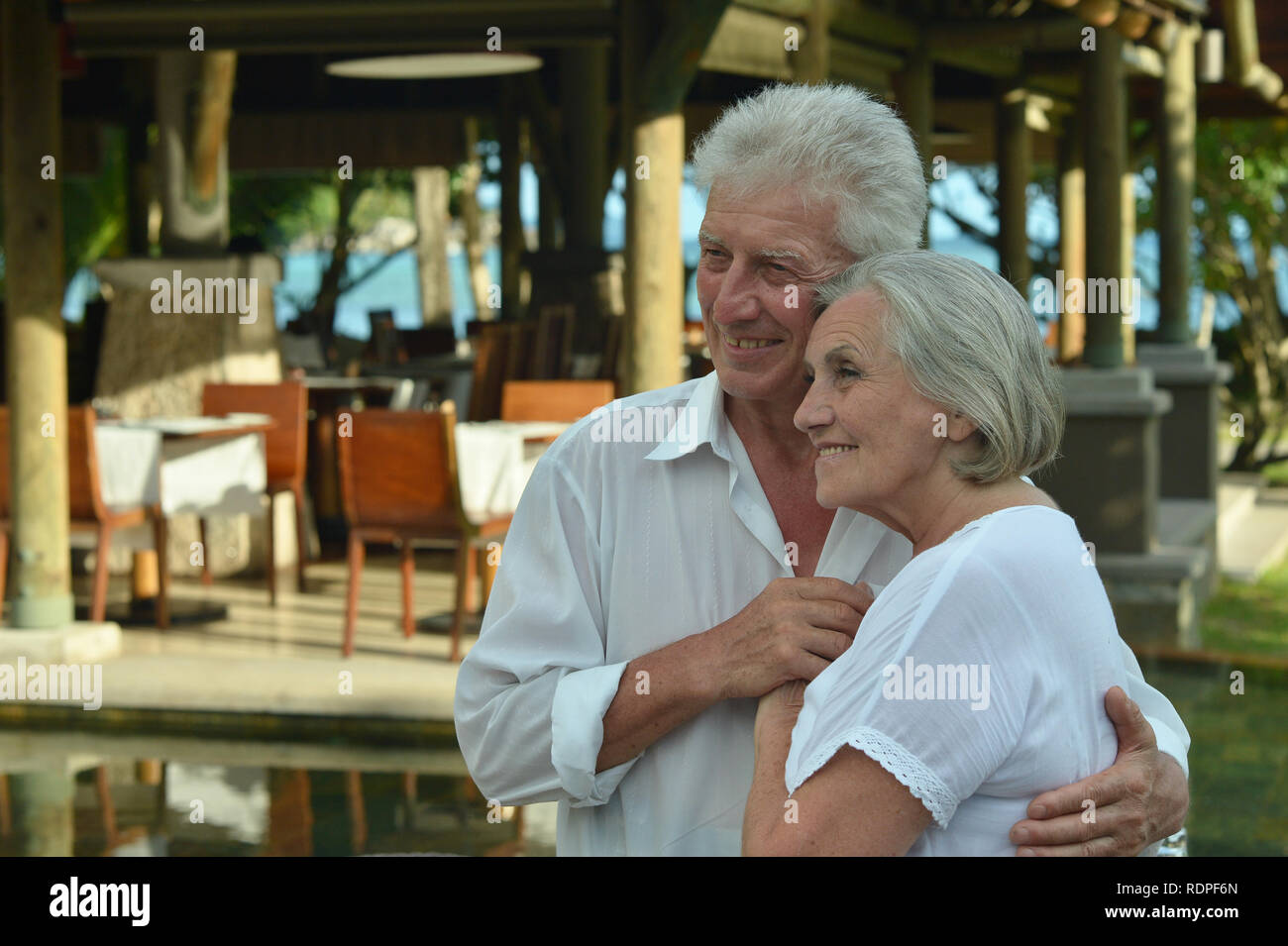 Portrait of elderly couple resting on tropical resort Stock Photo - Alamy