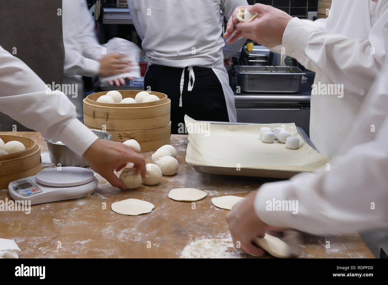 Motion of people are kneading the dough before it to be made dumplings ...