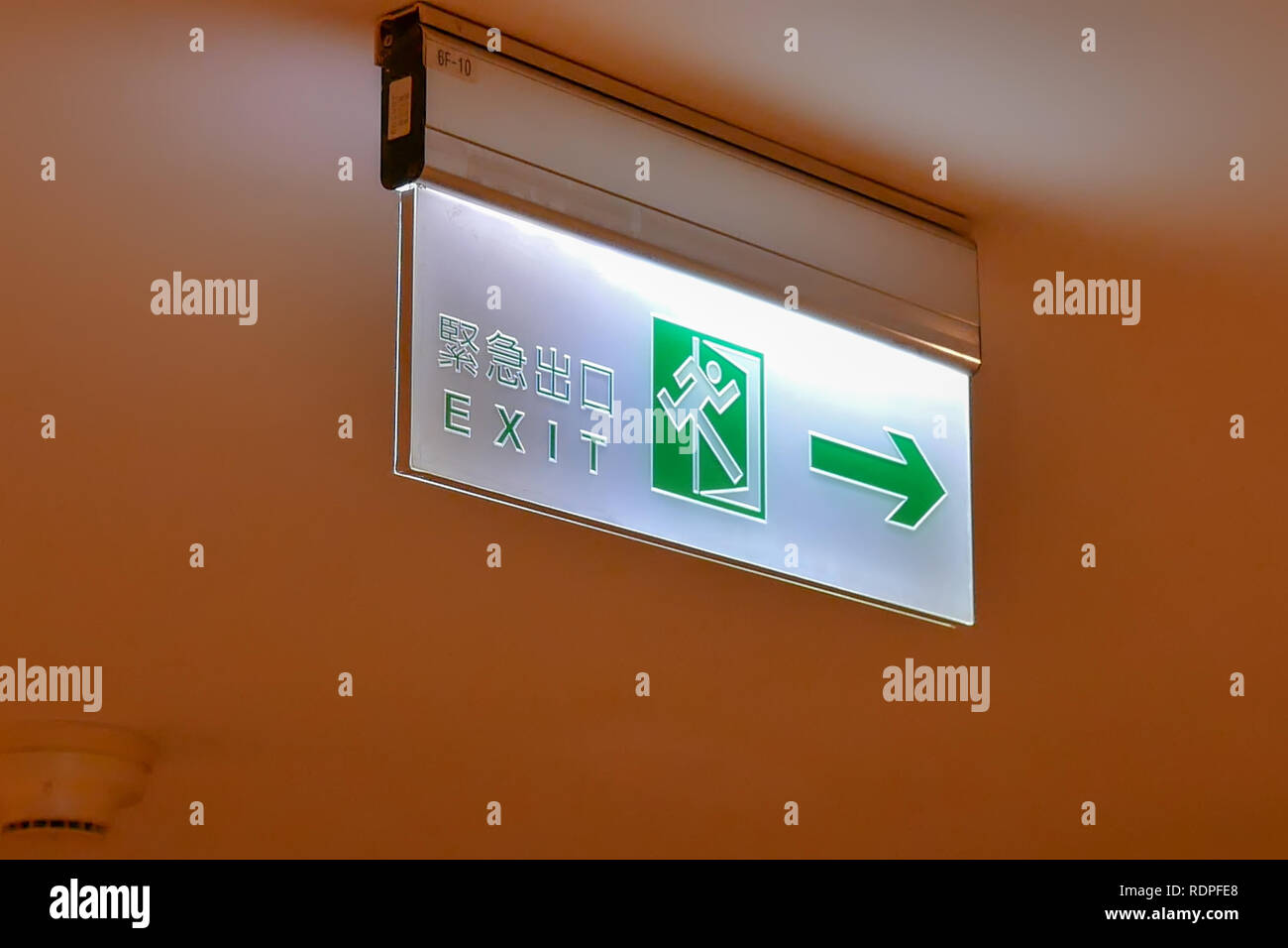 Close up of emergency exit sign write on Chinese and English word on ...