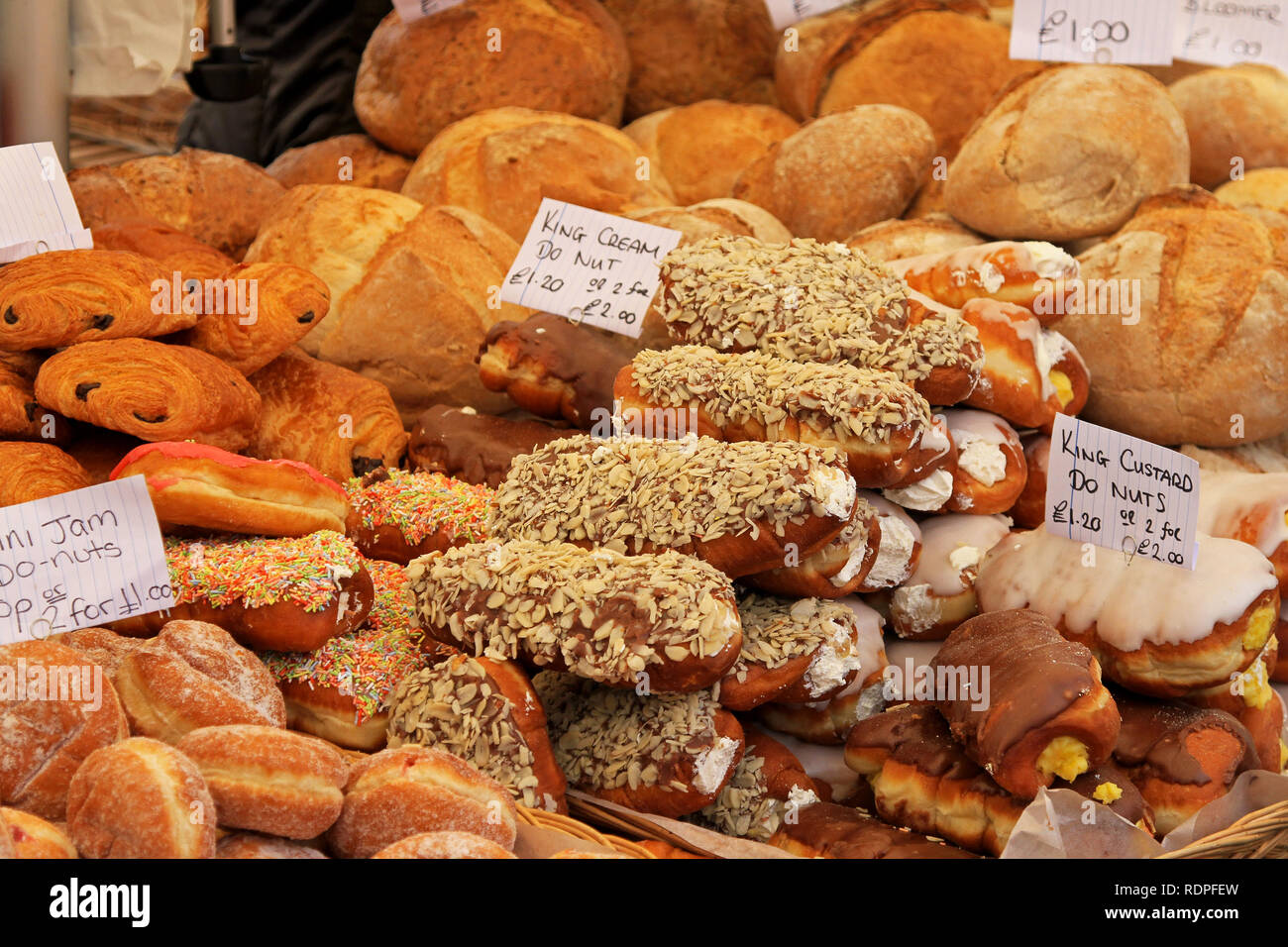 Bunch of freshly made pastry sold on market stall Stock Photo - Alamy
