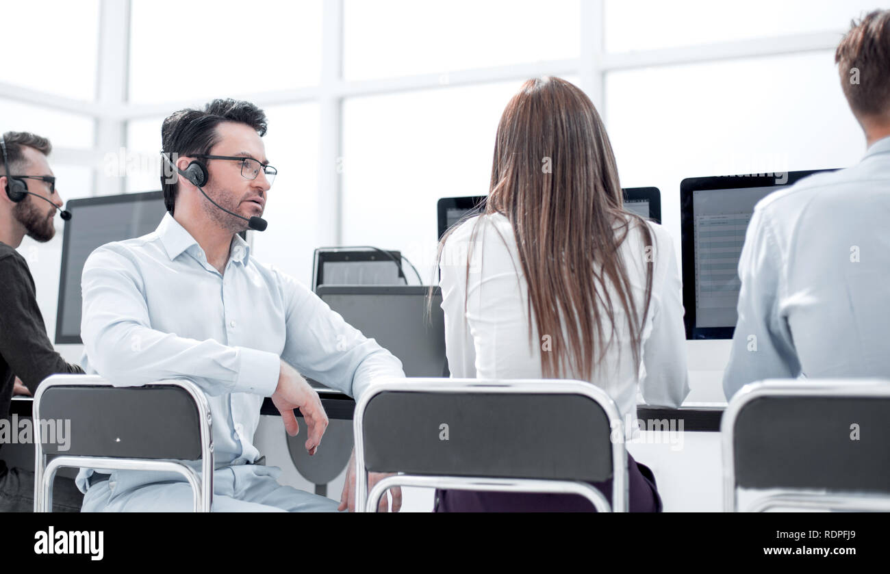 rear view.operator communication in the workplace in the call center ...