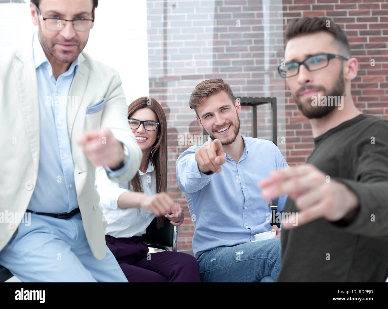 group of employees pointing their fingers at you. the concept of choice ...